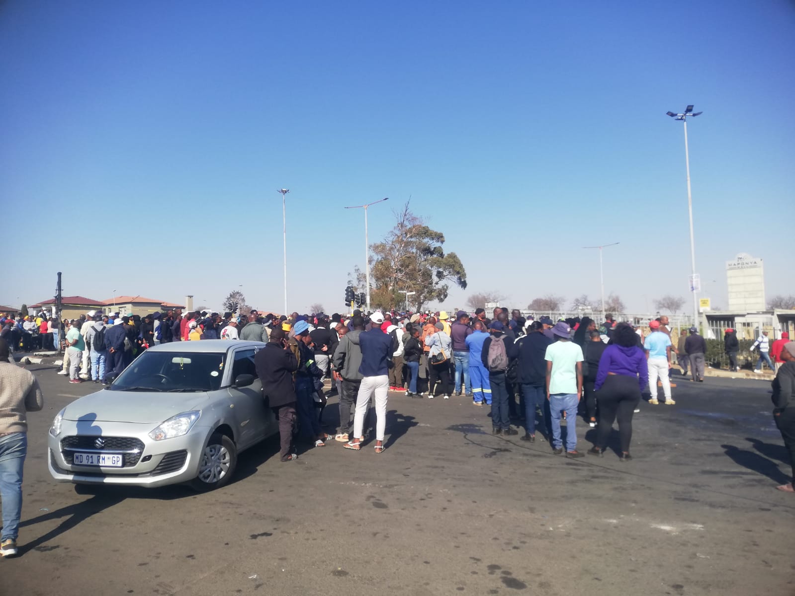 Protesters converge outside the Maponya Mall where the electronic hail ...